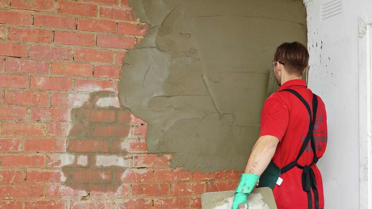 How do I install gypsum board over brick or concrete walls?
